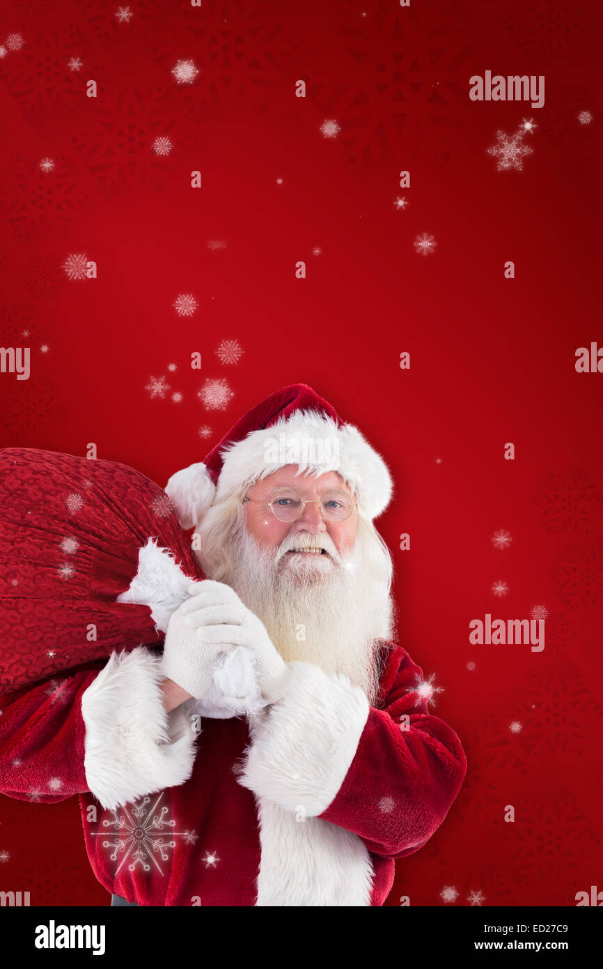 Composite image of santa claus measures his belly Stock Photo - Alamy