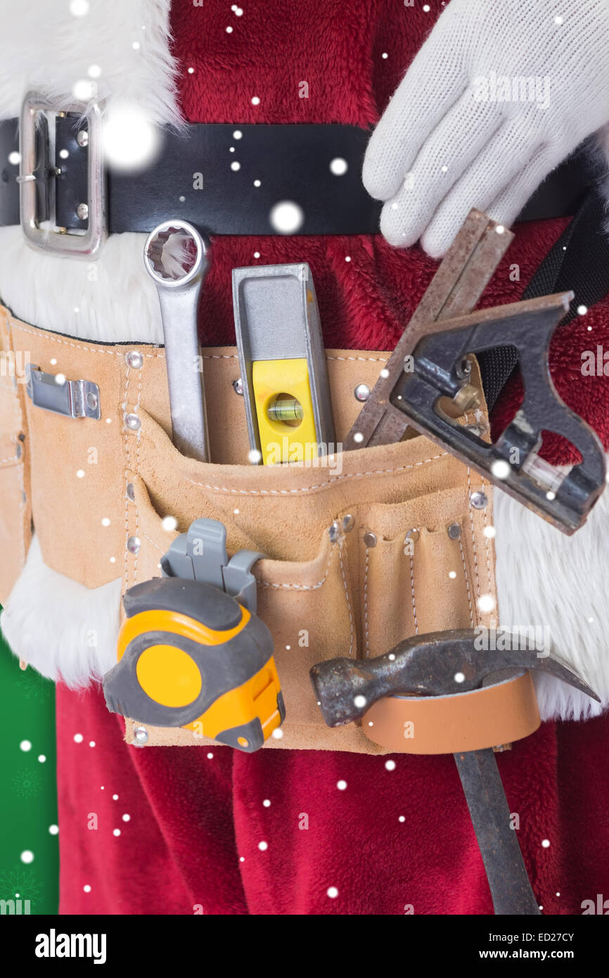 Composite image of father christmas is wearing a tool belt Stock Photo ...