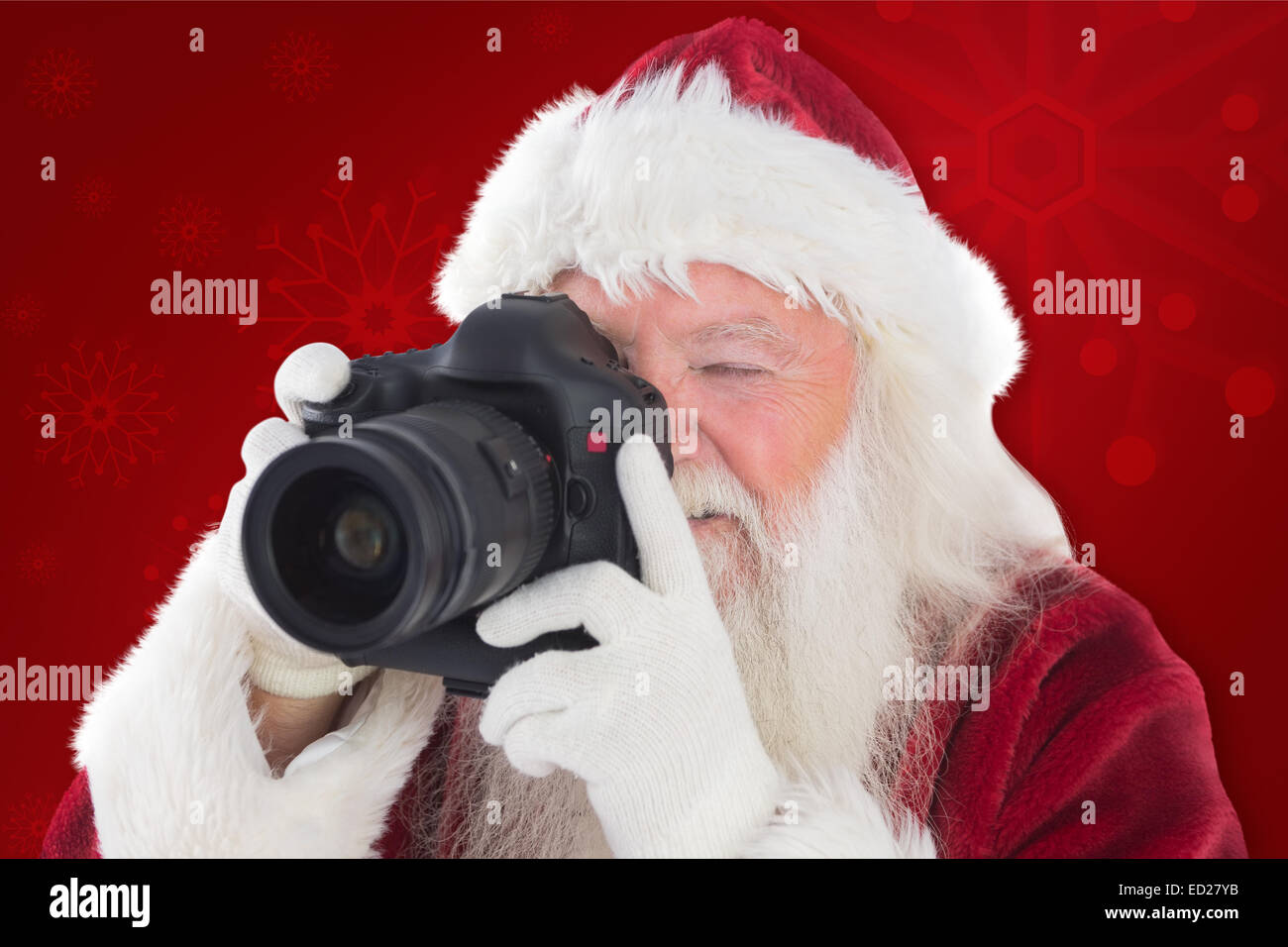Composite image of santa is taking a picture Stock Photo - Alamy