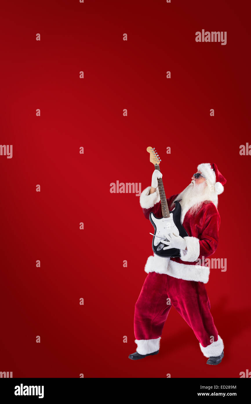 Happy santa playing electric guitar hi-res stock photography and images ...