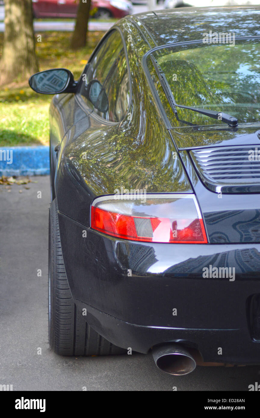 Brand expensive car. Rear wheel. Headlamp. Mirror Front View Sunny day ...