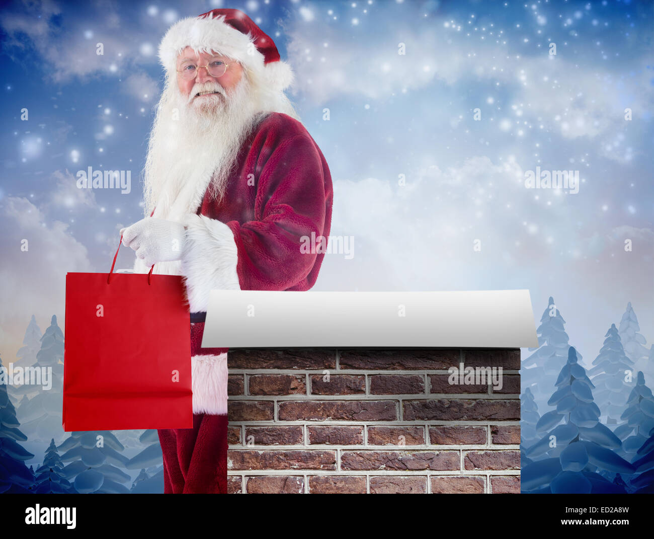 Composite image of santa carries red gift bag Stock Photo - Alamy