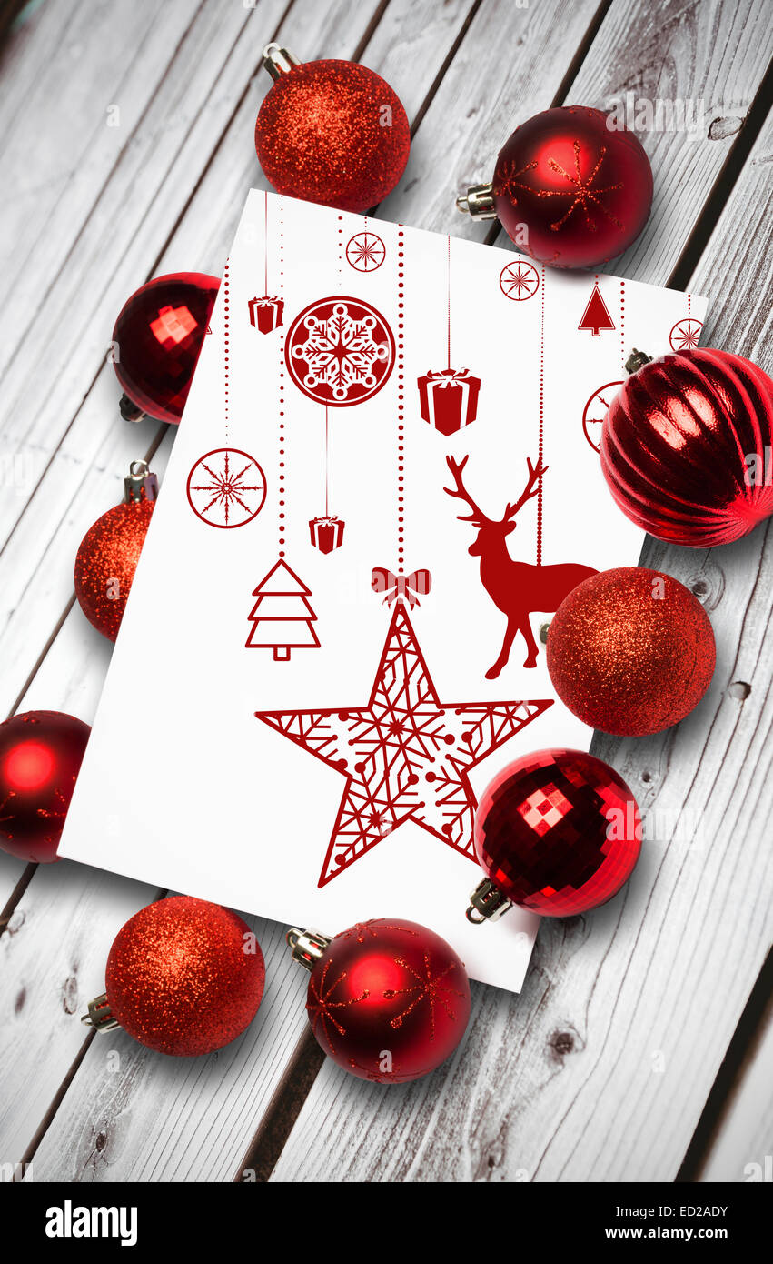 Composite image of hanging red christmas decorations Stock Photo - Alamy
