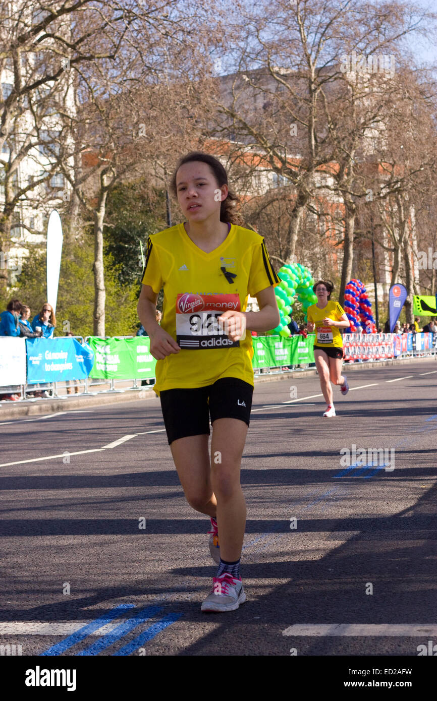 LONDON - APRIL 13: Unidentified girls run the London marathon on April ...