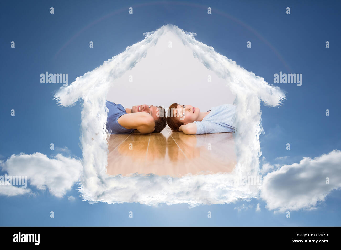 Composite image of couple lying on the floor Stock Photo - Alamy