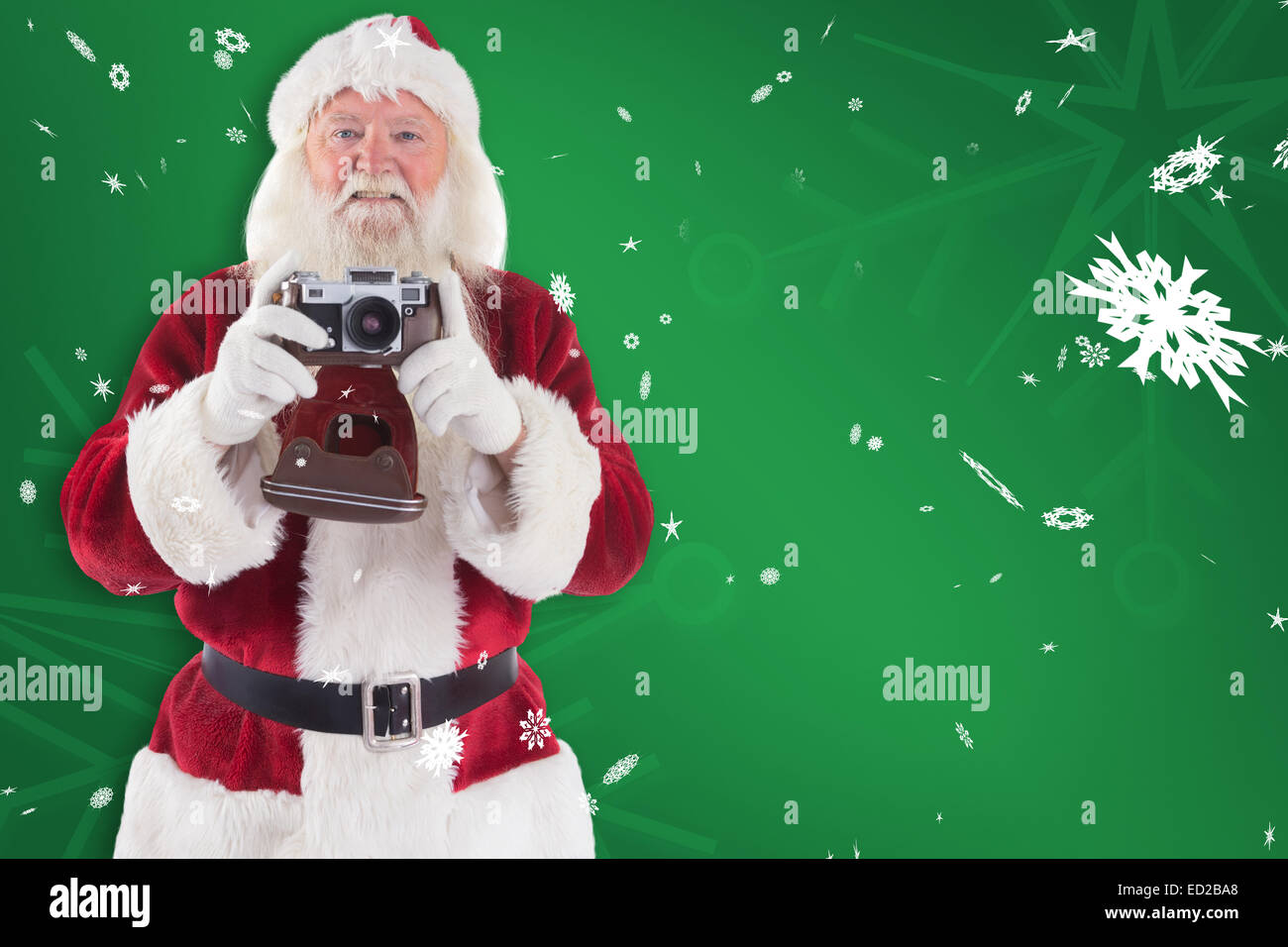 Composite image of santa is taking a picture Stock Photo - Alamy