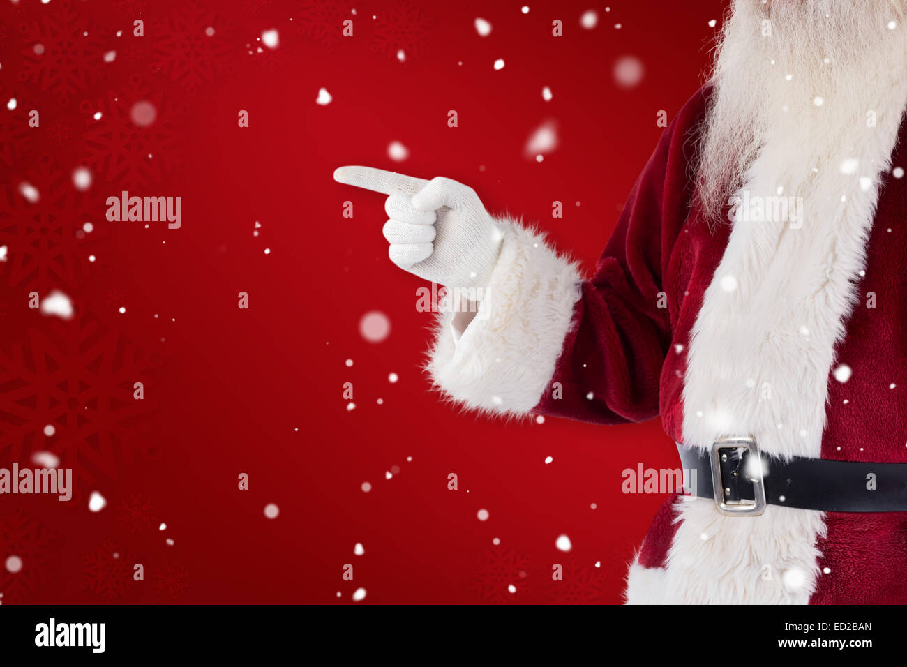 Composite image of santa claus points at something Stock Photo - Alamy