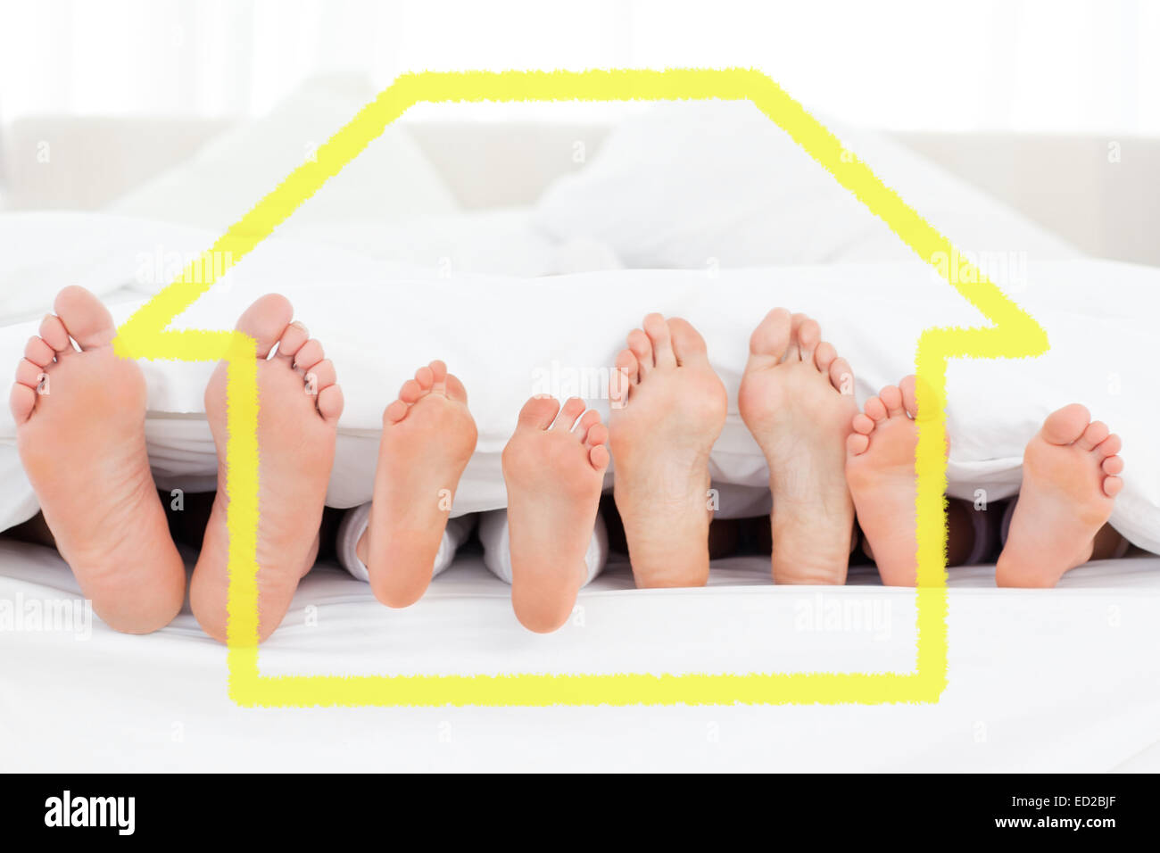 Composite image of feet in bed pointing straight up Stock Photo - Alamy