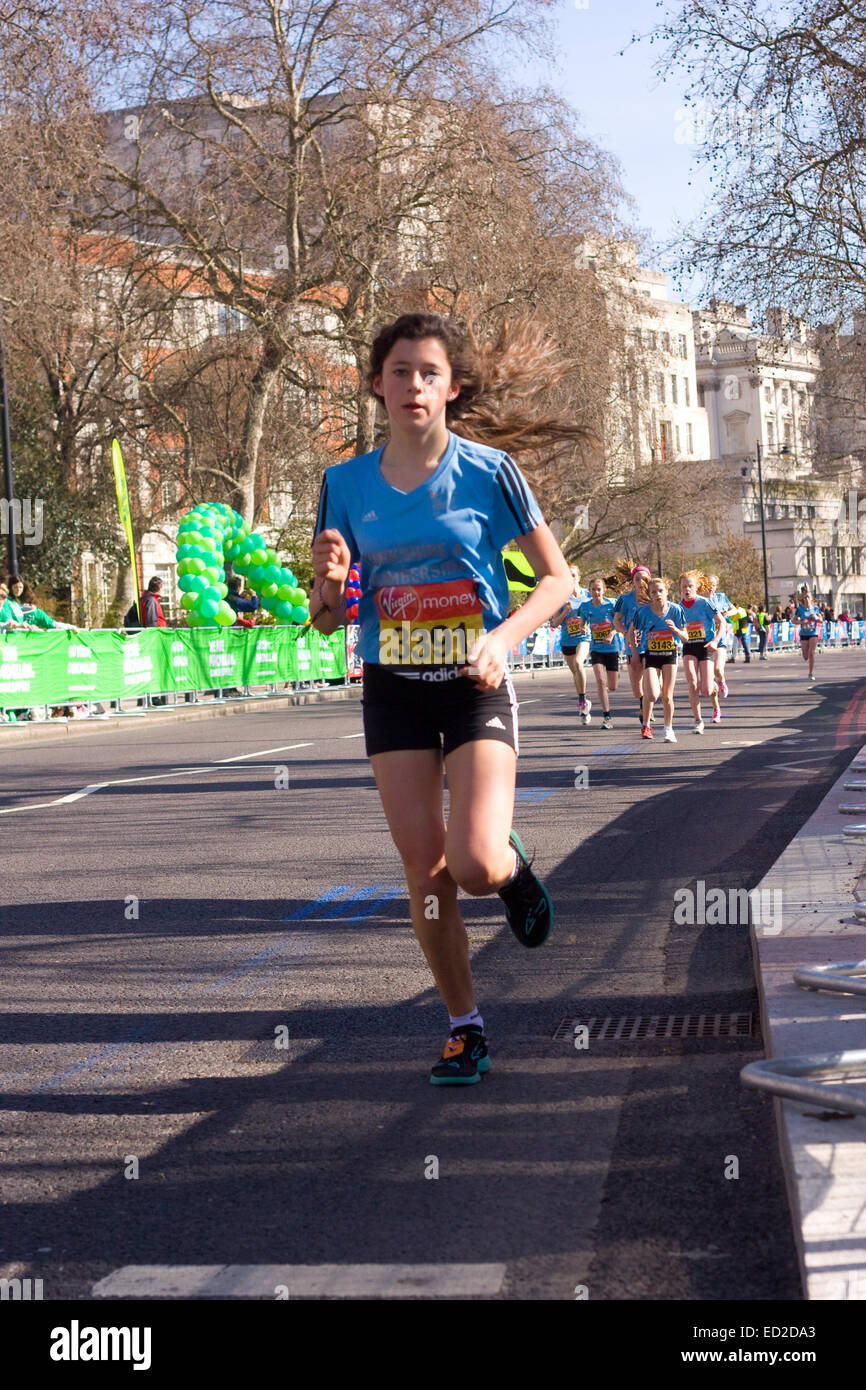 LONDON - APRIL 13: Unidentified girls run the London marathon on April ...