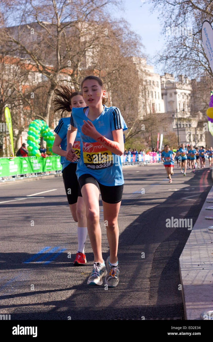 LONDON - APRIL 13: Unidentified girls run the London marathon on April ...