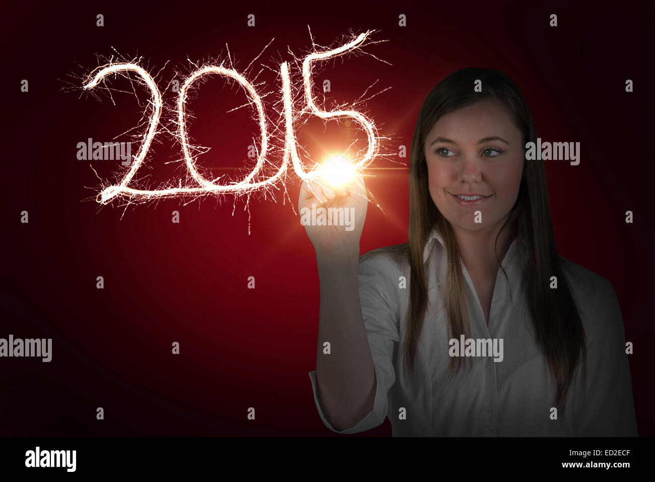 Composite image of businesswoman touching spark Stock Photo - Alamy
