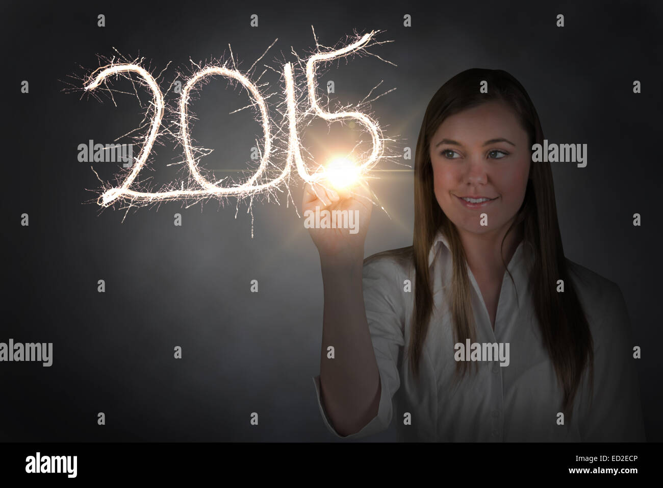 Composite image of businesswoman touching spark Stock Photo - Alamy