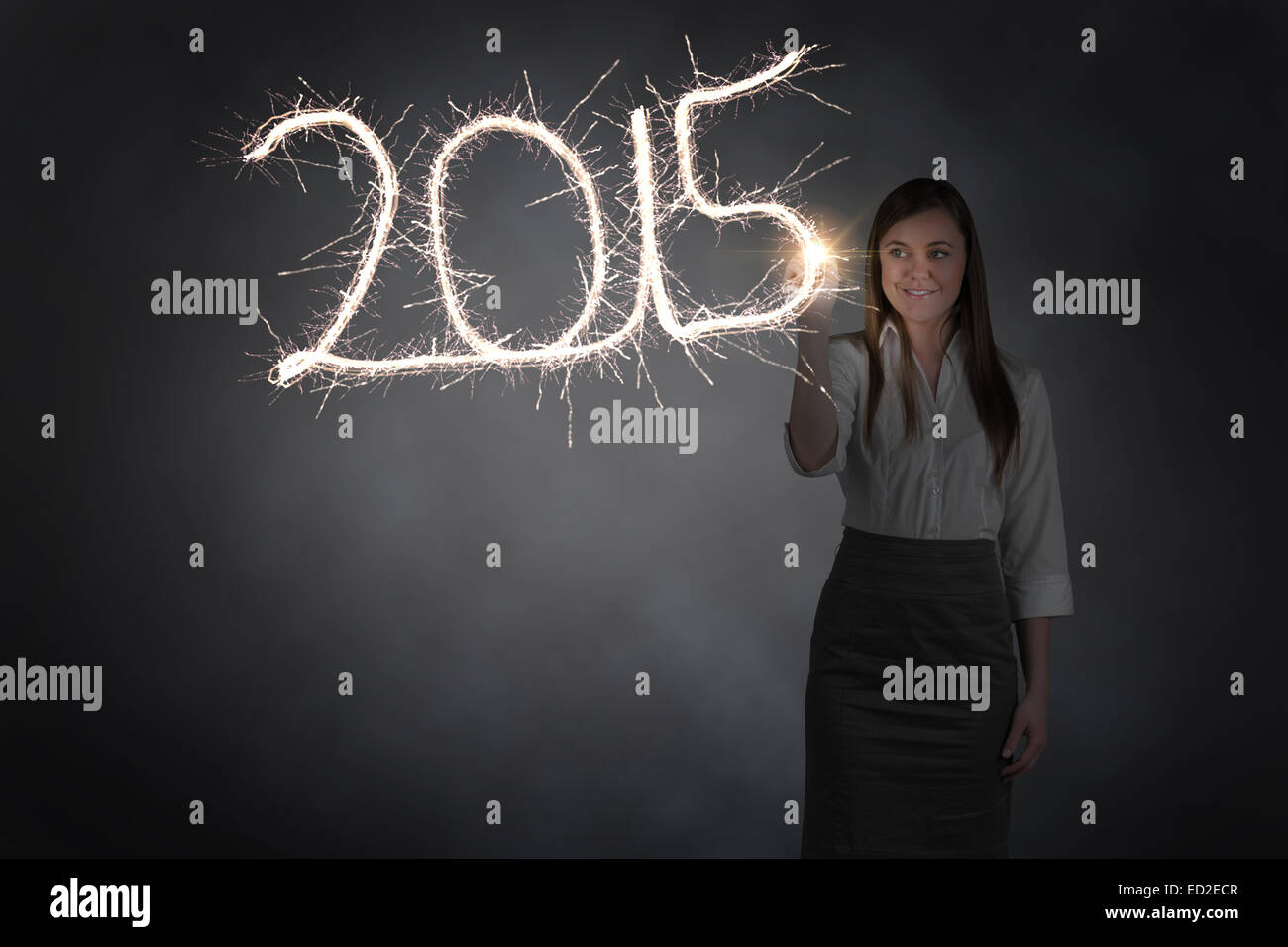 Composite image of businesswoman touching spark Stock Photo - Alamy
