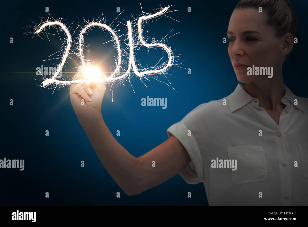 Composite image of businesswoman touching spark Stock Photo - Alamy
