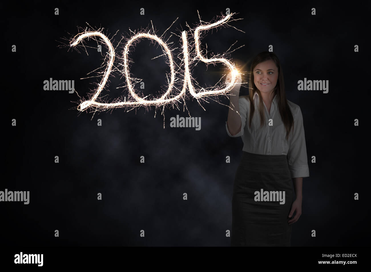 Composite image of businesswoman touching spark Stock Photo - Alamy