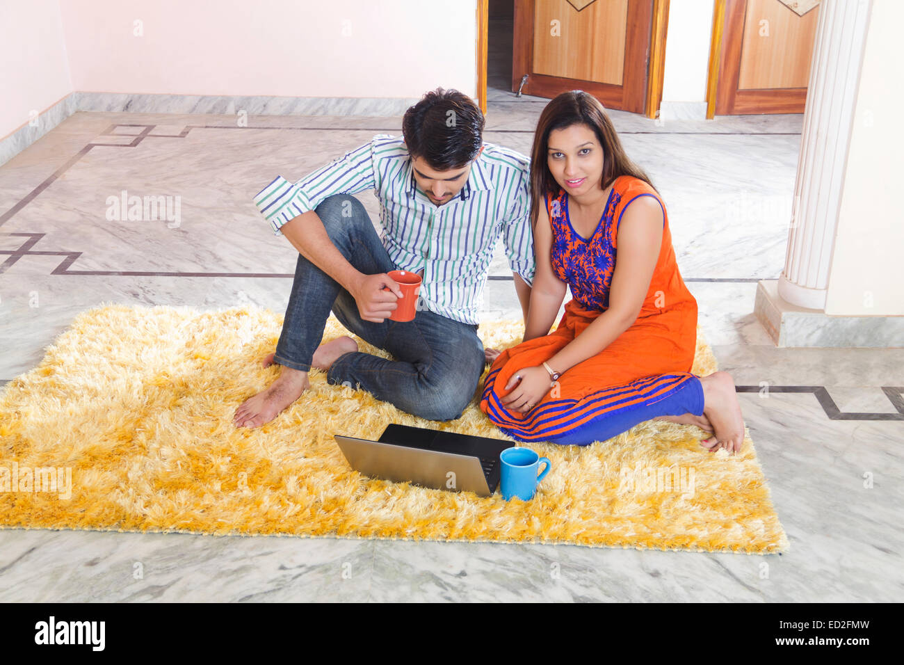 2 indian married couple home laptop working Stock Photo - Alamy
