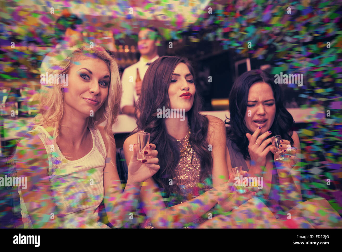 Composite image of happy friends drinking shots together Stock Photo ...