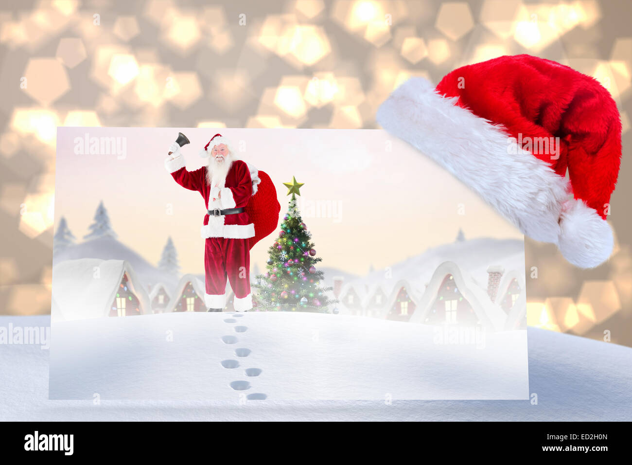 Composite image of santa delivery presents to village Stock Photo - Alamy