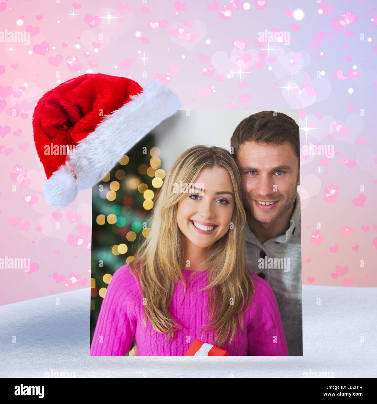 Composite image of happy couple holding each other Stock Photo - Alamy