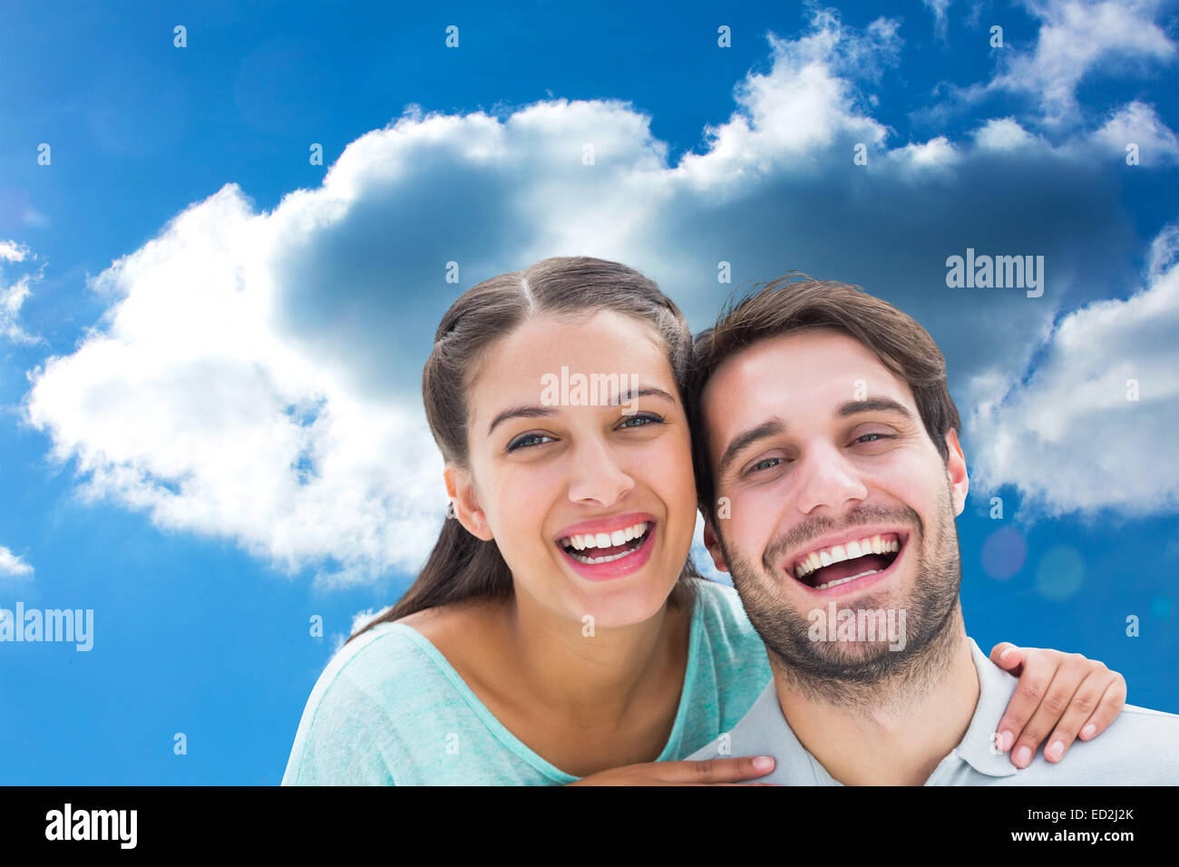 Composite image of cute couple smiling at camera Stock Photo - Alamy