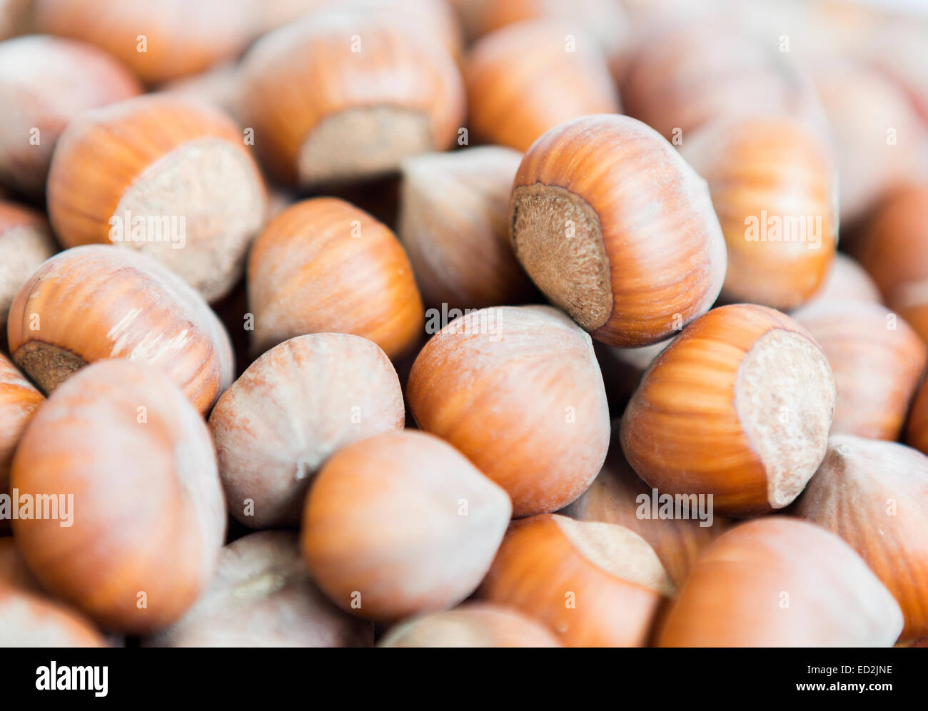 Unpeeled hazelnuts. Healthy organic eating Stock Photo - Alamy