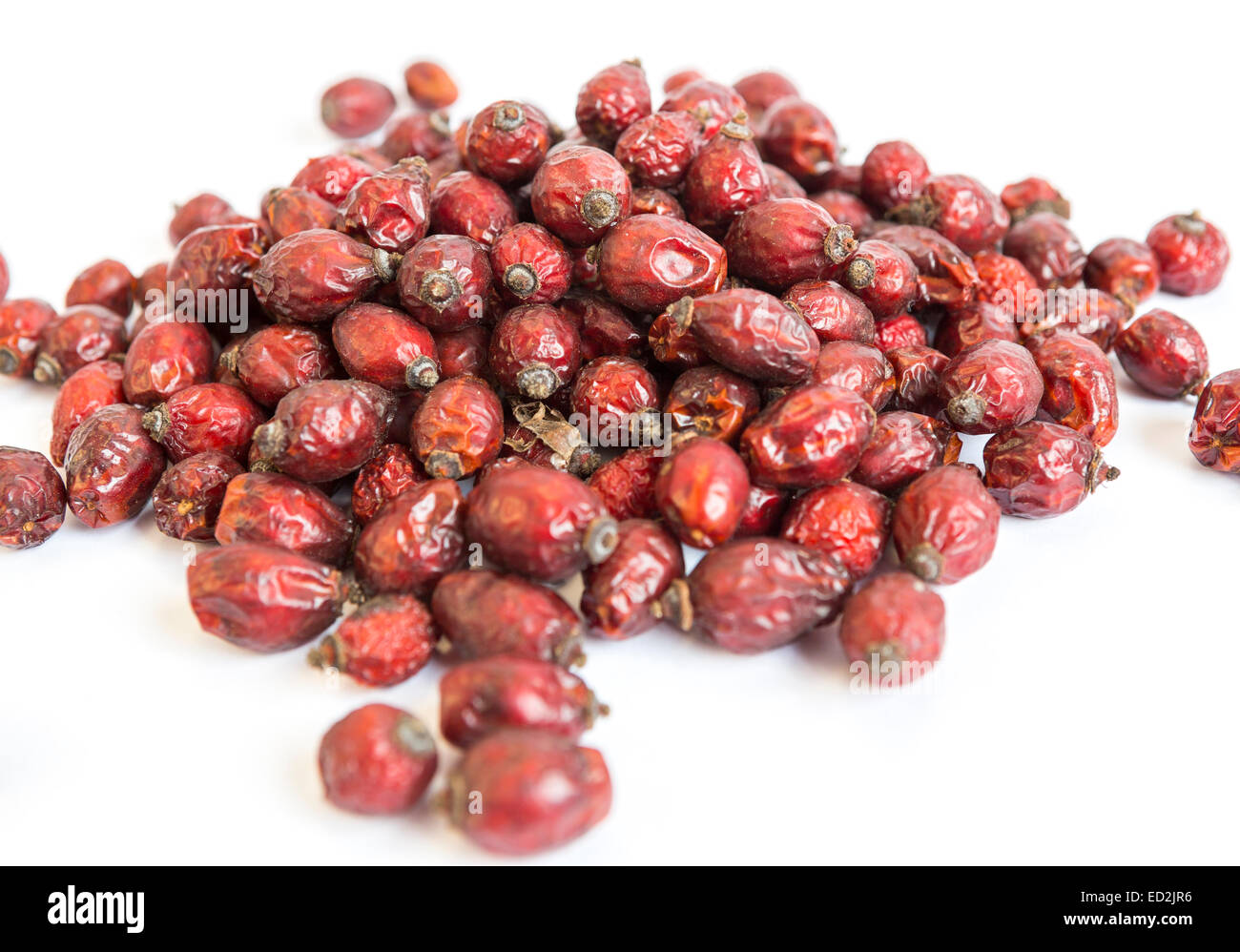 Dried rose briars on white. Healthy organic eating Stock Photo - Alamy