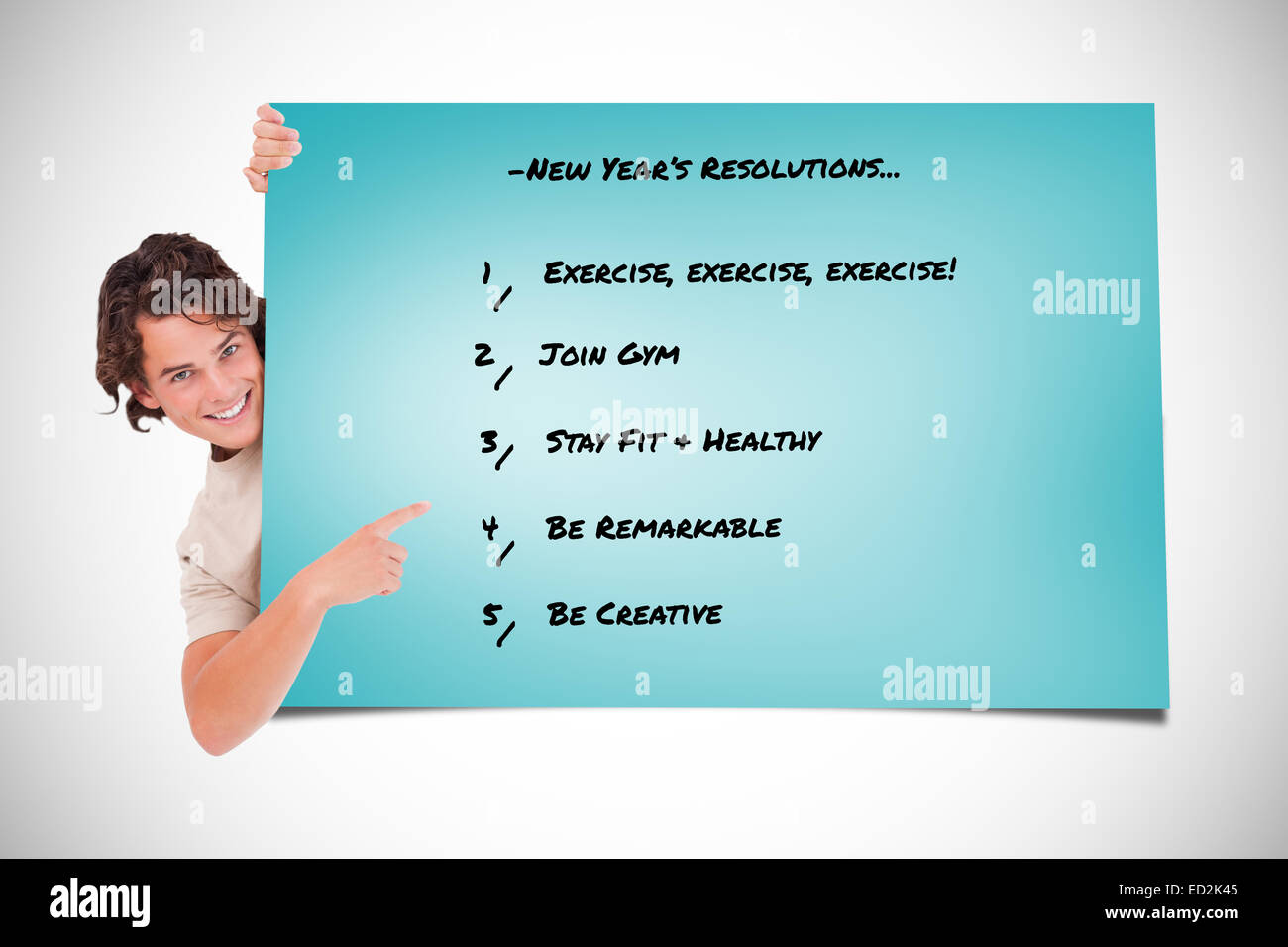 Composite image of cute guy pointing at a list looking into a camera ...