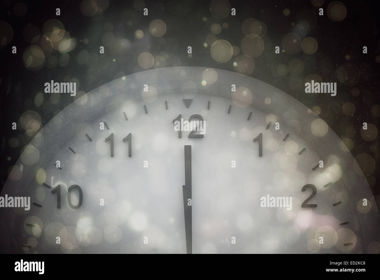Composite image of clock at midnight Stock Photo - Alamy