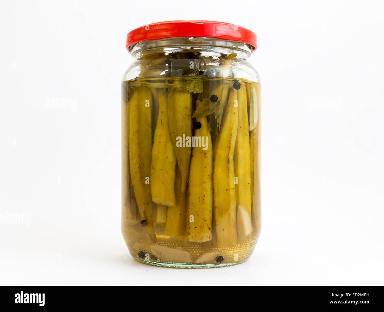 Okra in a jar isolated on white Stock Photo - Alamy
