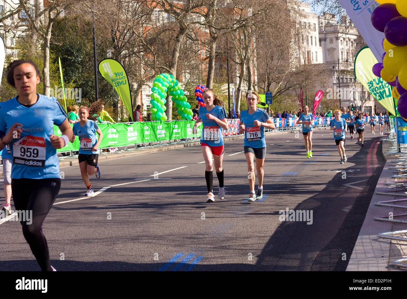 LONDON - APRIL 13: Unidentified girls run the London marathon on April ...
