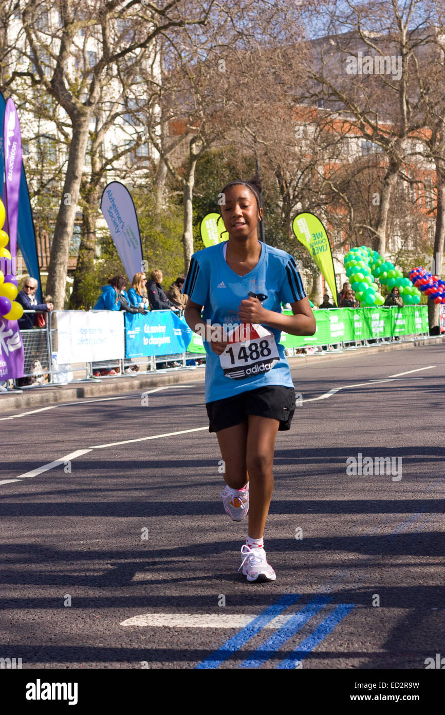 LONDON - APRIL 13: Unidentified girls run the London marathon on April ...