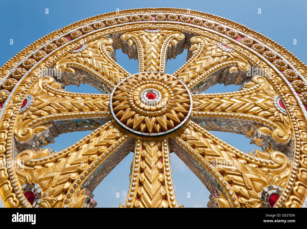 Golden wheel statue in the Thai temple Stock Photo - Alamy