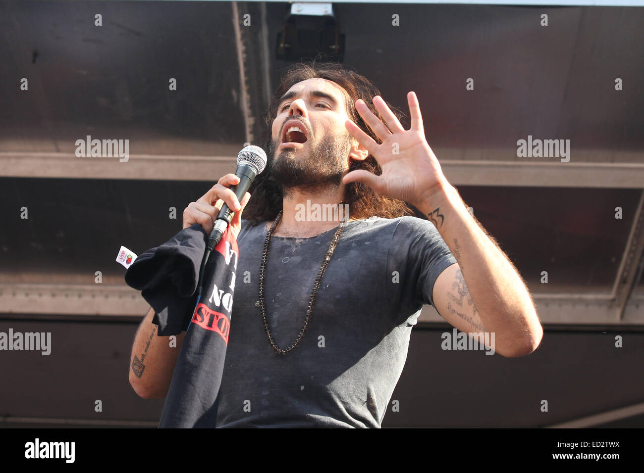 Russell Brand addresses the crowd of protesters at the anti-austerity ...