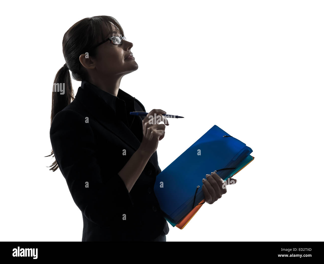 one business woman looking up holding folders files silhouette studio ...