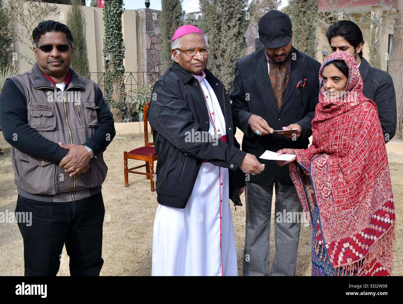 Bishop Victor distributes cheque among needy persons during ceremony in ...