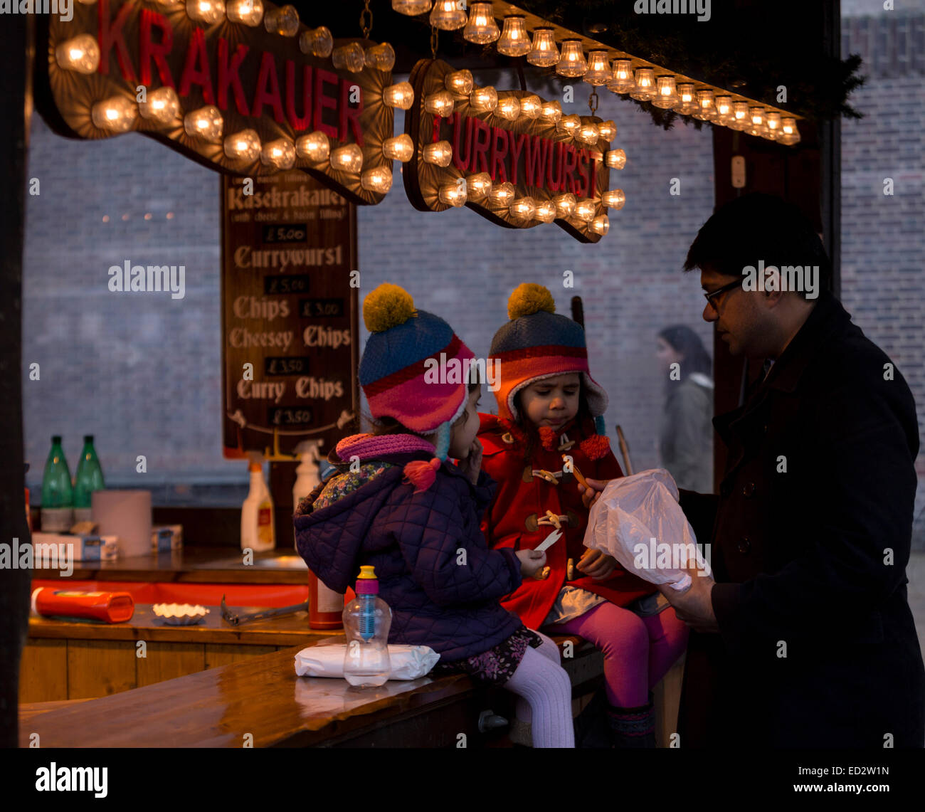 London, UK. 24th Dec, 2014. Tourists visiting the Christmas Market at ...