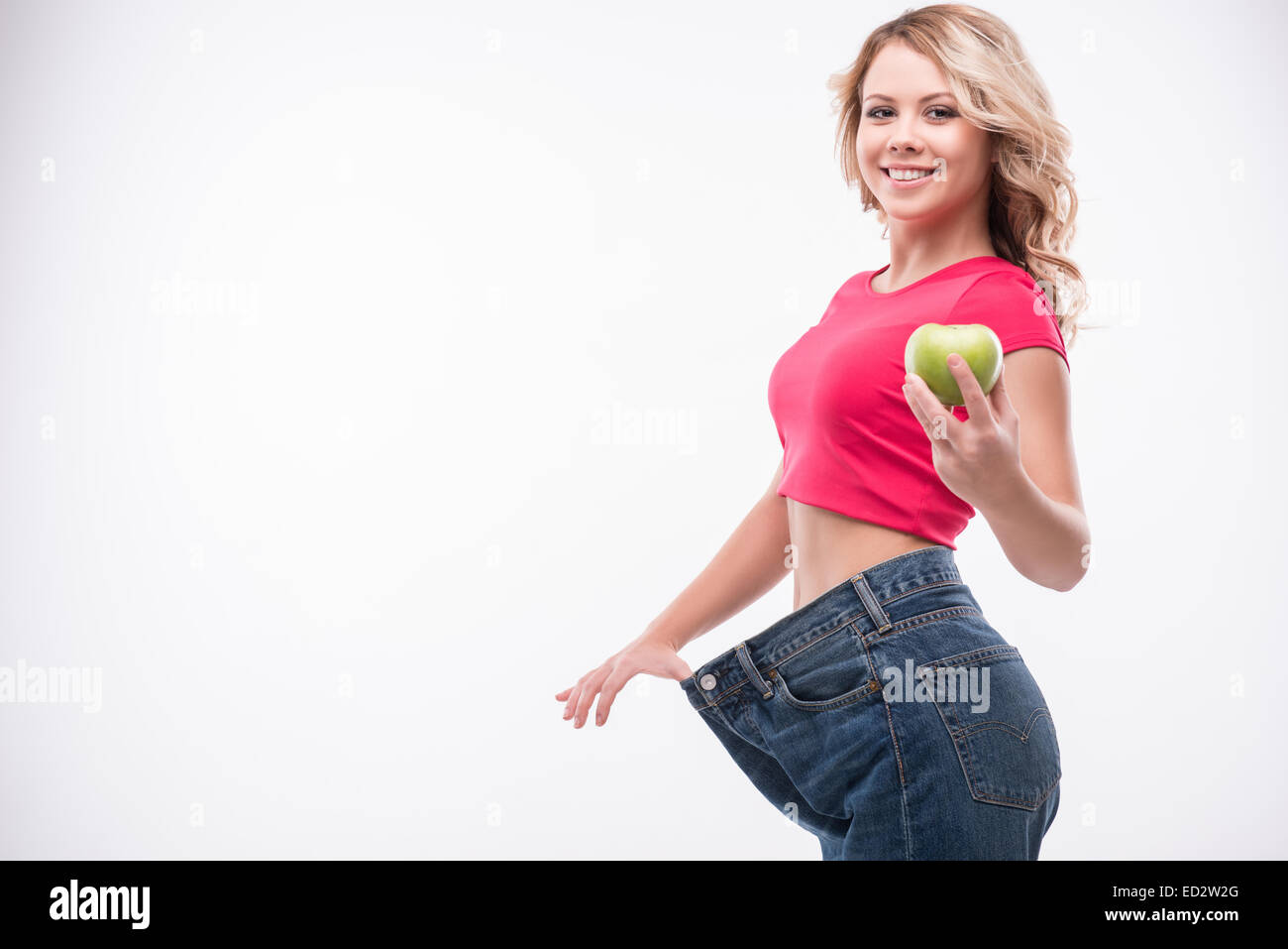 Full-length portrait of attractive slim young smiling woman in b Stock ...
