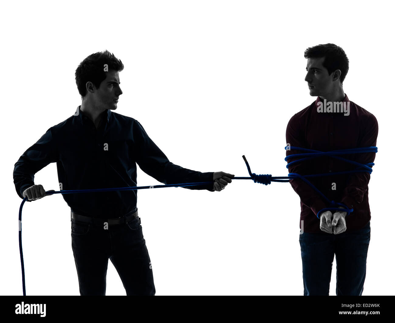 two young men in shadow white background Stock Photo - Alamy