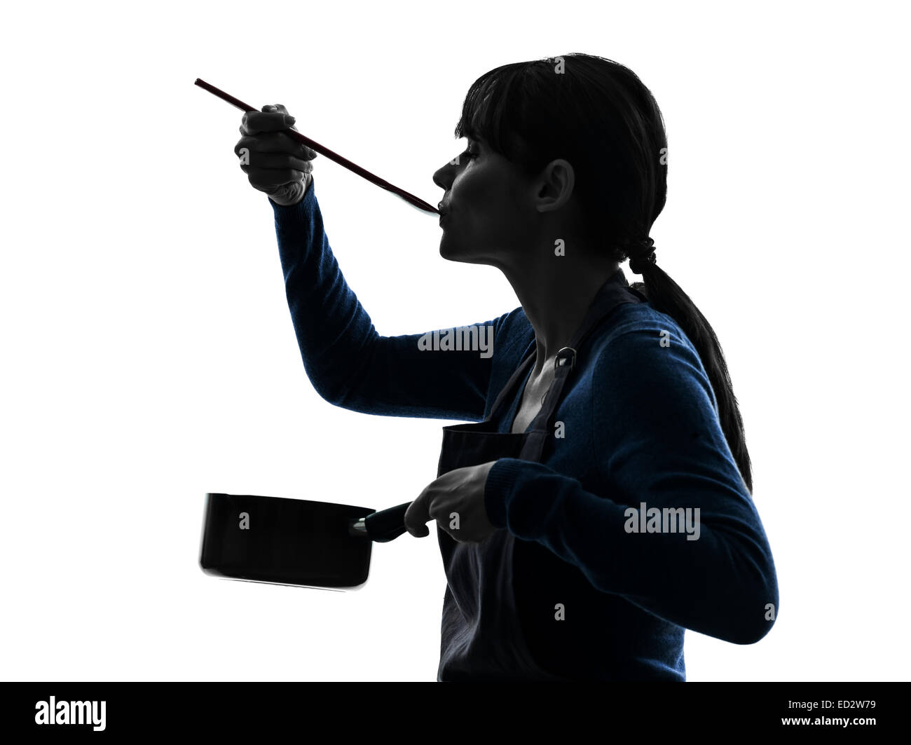 one woman cooking tasting saucepan in silhouette studio isolated on ...