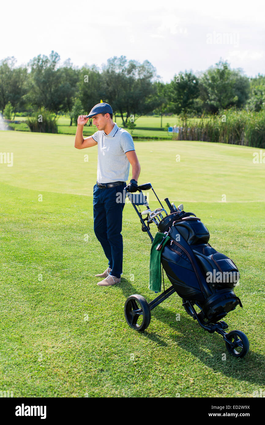 Young man playing golf Stock Photo - Alamy