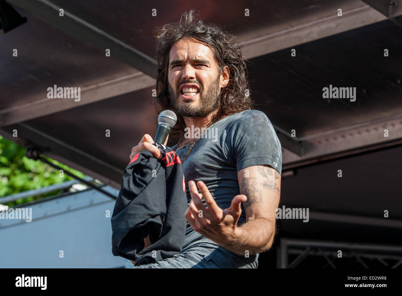 Russell Brand speaks to thousands of anti-austerity protesters at a UK ...