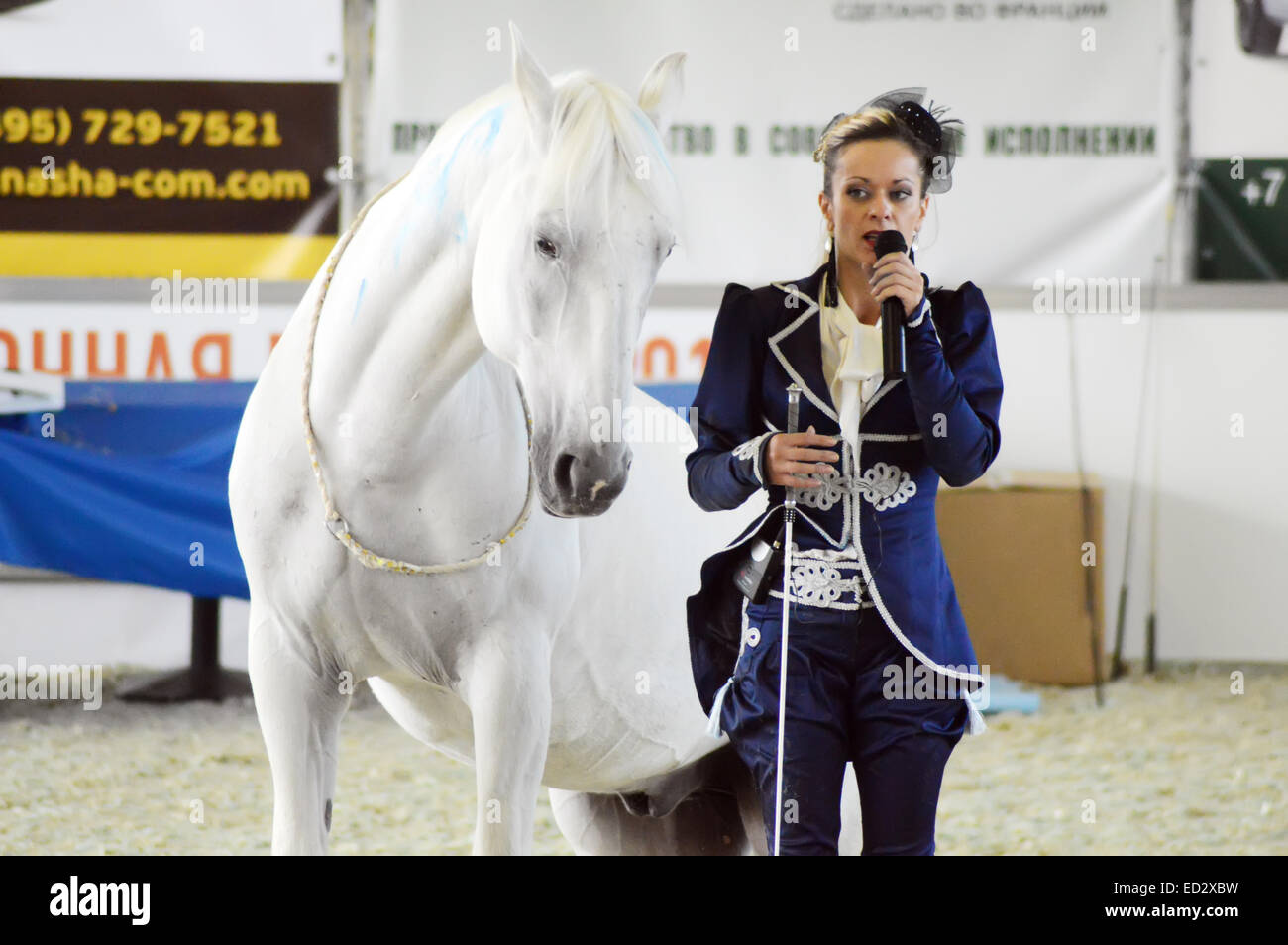 Moscow International Equestrian Exhibition Woman jockey and white horse ...