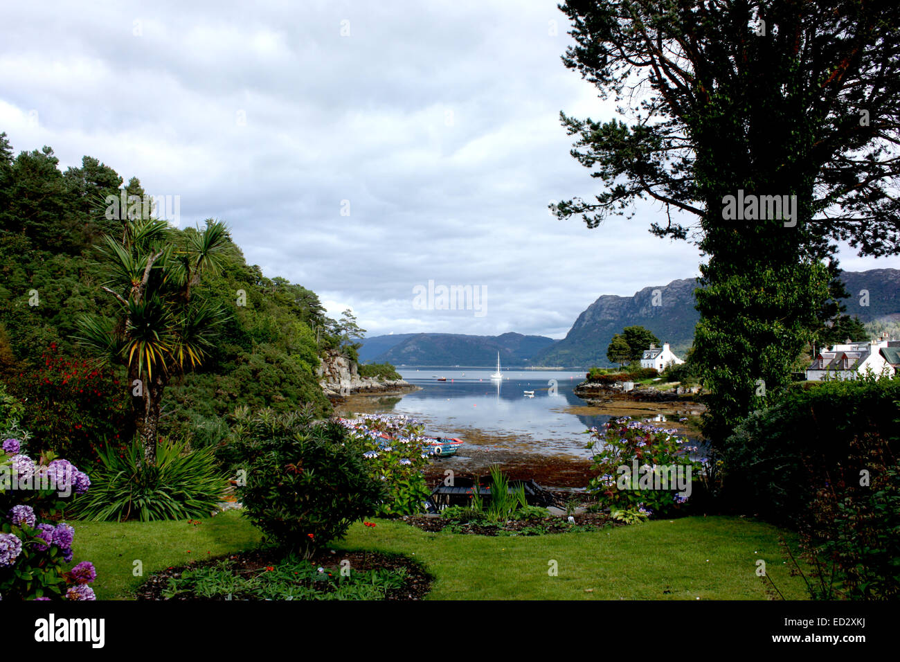 A garden in Plockton on the west coast of Scotland showing the ...