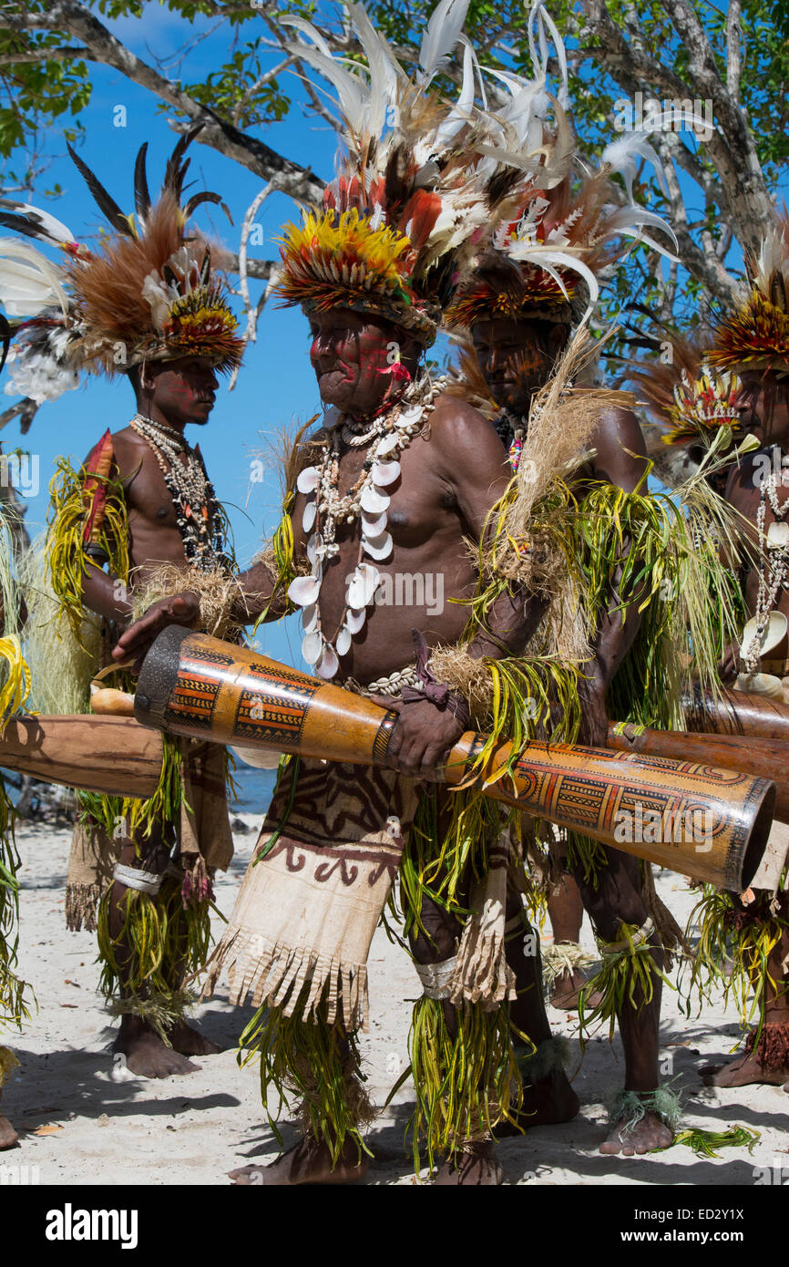 Papua New Guinea, Tufi. Traditional sing-sing, men with drums dressed ...