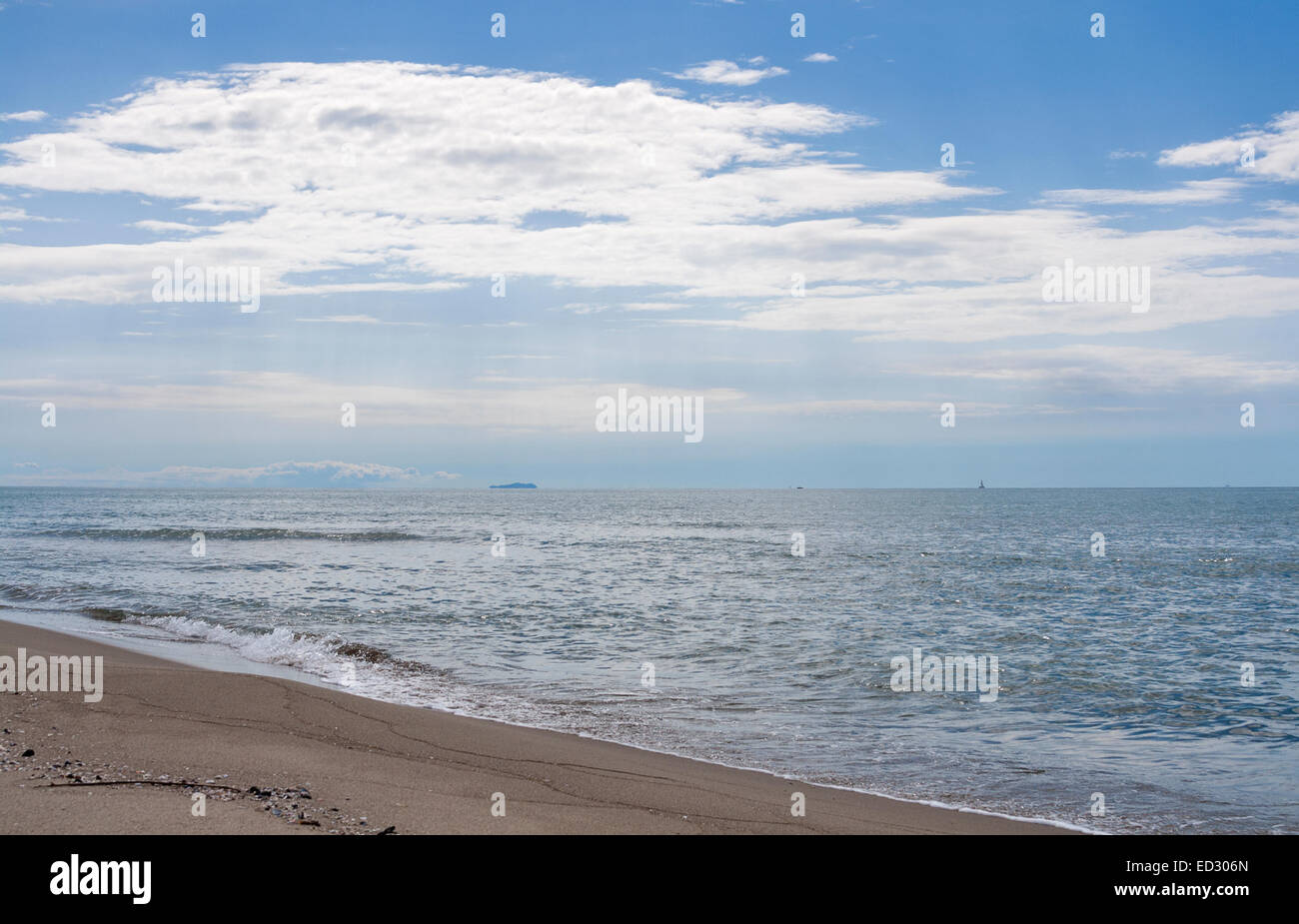 Tuscany sand beach with island, Italy Stock Photo - Alamy