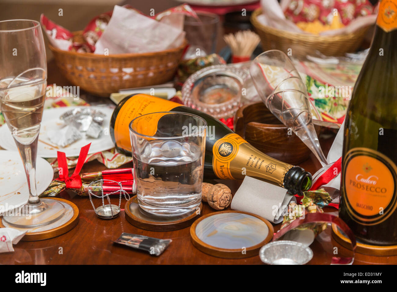 Debris in the aftermath of a festive season party with an empty Veuve ...