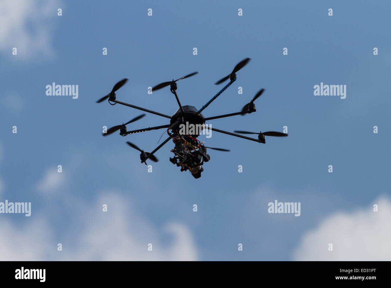 A Black Octocopter is flying Camera Stock Photo - Alamy