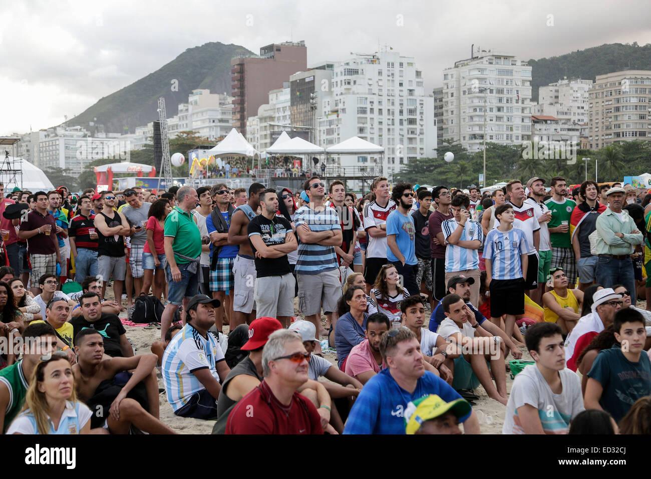 Fans at FIFA Fan Fest Rio de Janeiro watch the televised Group G match ...