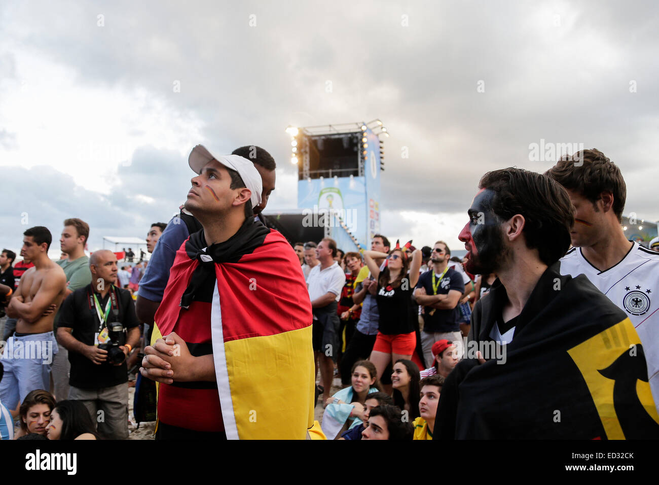 Fans at FIFA Fan Fest Rio de Janeiro watch the televised Group G match ...