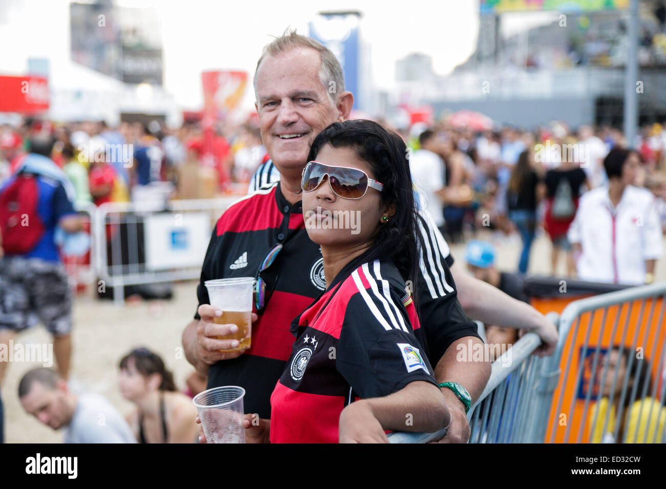 Fans at FIFA Fan Fest Rio de Janeiro watch the televised Group G match ...